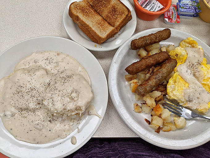 Breakfast of champions: golden hash browns, scrambled eggs, sausage links, and the star attraction &ndash; biscuits swimming in velvety gravy.