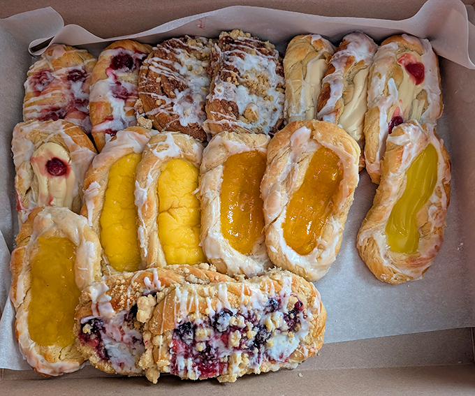 A box of Danish pastries that makes you wonder why you'd ever settle for airport pastries again – each one a flaky, fruit-filled promise of better mornings.