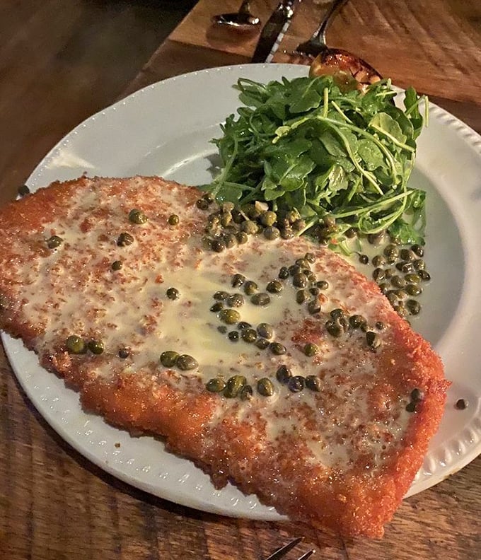 The breaded pork loin with capers and lemon &ndash; crispy, tender, and bright with acid that cuts through richness like a well-timed joke.