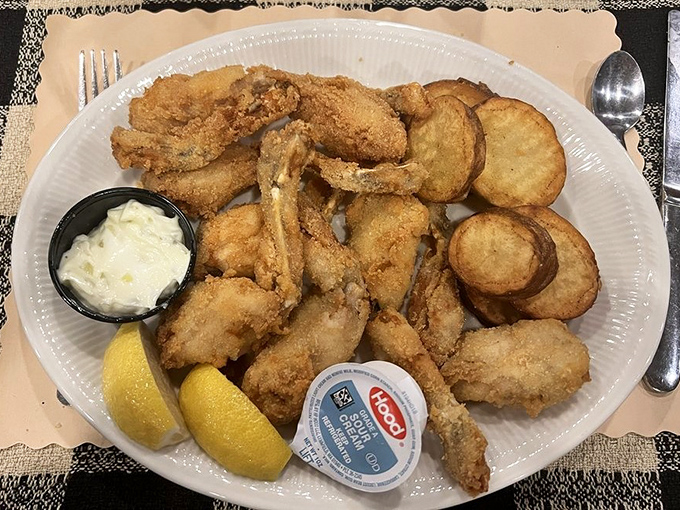 Crispy breaded frog legs with golden potatoes &ndash; a delicious throwback to supper club menus of yesteryear.