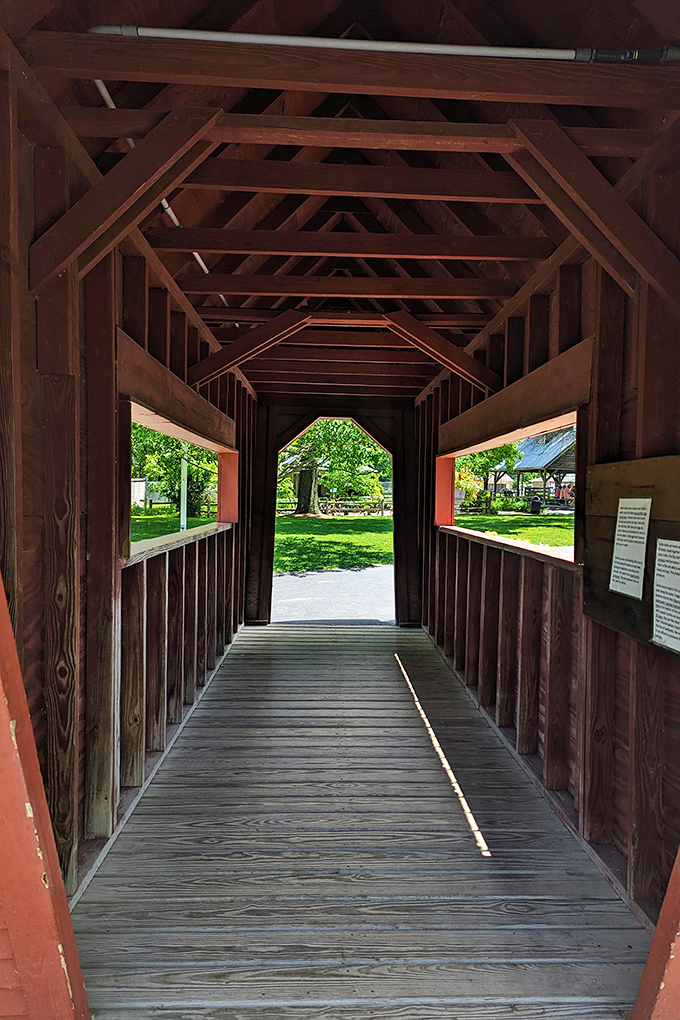 Inside the wooden bridge, sunlight filters through slats creating patterns that have inspired countless games of "Billy Goats Gruff."