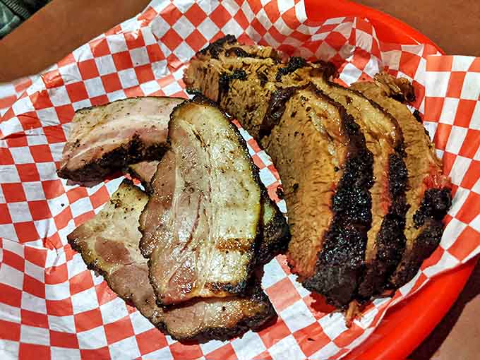 These slices of brisket tell a story of time and smoke, with a pink ring that whispers secrets of the pitmaster's craft.