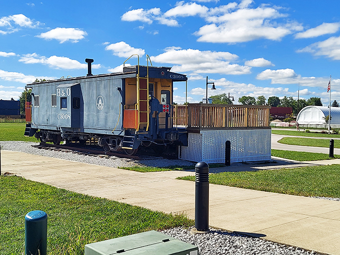 The restored caboose exterior hints at the surprisingly cozy quarters where railroad crews once spent their long journeys.