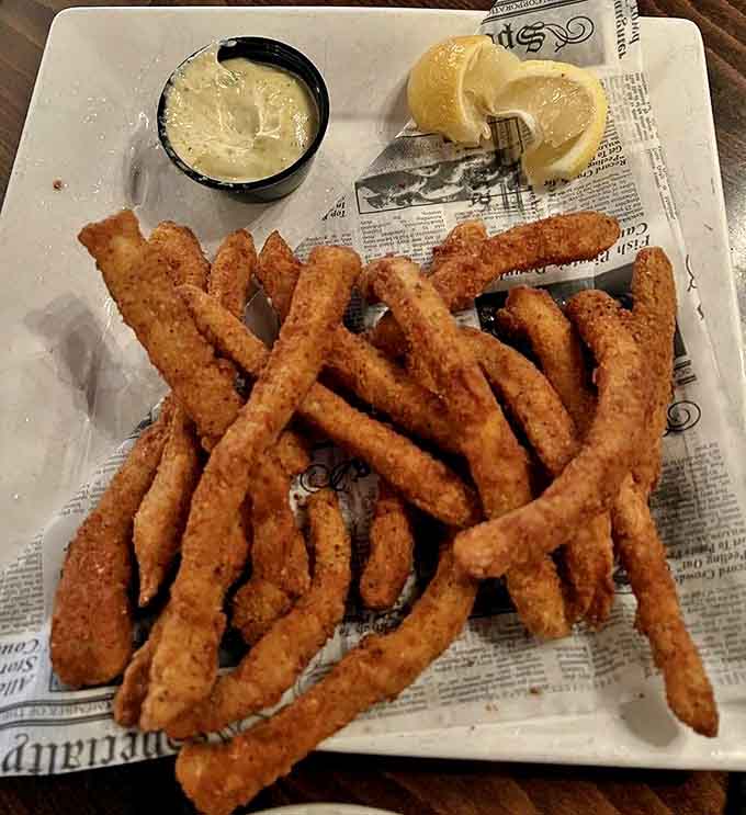 These aren't just any calamari &ndash; they're golden-brown rings of perfection, crispy outside, tender within, served with a lemony aioli that makes sharing painful.
