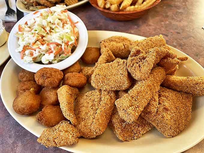 Crispy catfish bites with creamy coleslaw &ndash; Southern comfort on a plate that proves Chuck's mastery extends beyond the smoker.