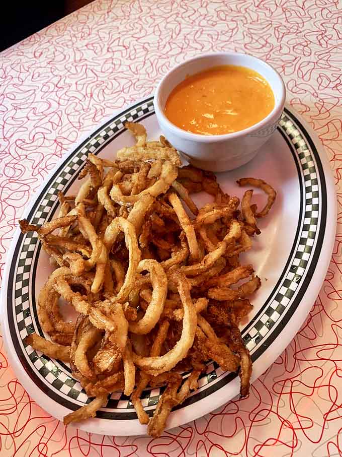Crispy onion strings: Golden-fried wisps of onion with dipping sauce &ndash; like edible haystack that's impossible to stop eating once you start.