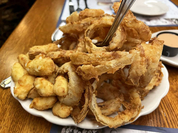 These aren't just any cheese curds and onion rings &ndash; they're crispy, golden ambassadors of Midwestern appetizer perfection, demanding to be shared.
