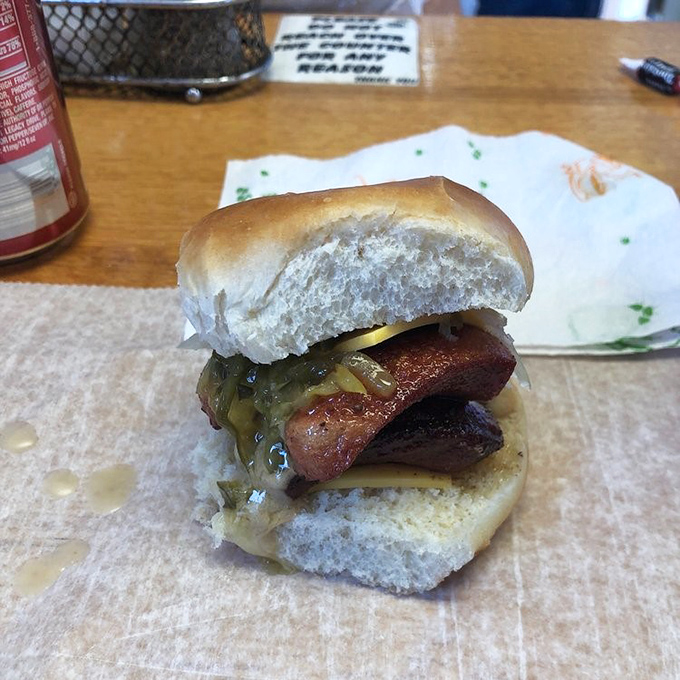 A perfectly grilled hot dog nestled in a soft bun with sweet relish &ndash; proof that Crabill's excellence extends beyond their famous burgers.