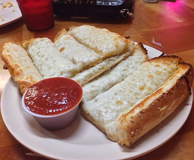 Garlic cheese bread that stretches like it's auditioning for the Olympics gymnastics team &ndash; gold medal in the carb category guaranteed.