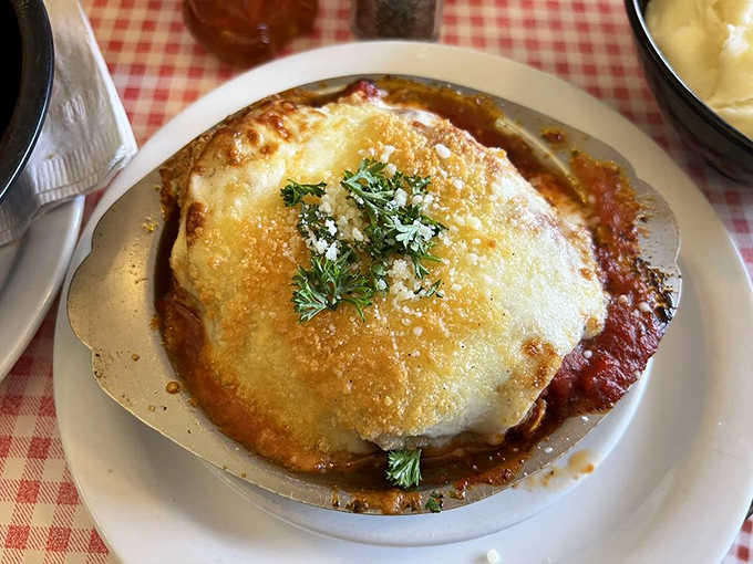 Bubbling cheese blankets this chicken parmesan, creating the kind of comfort food that makes you want to hug the chef.