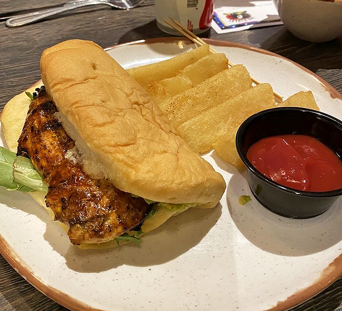 Not your average chicken sandwich &ndash; this jerk-spiced beauty brings island heat to a classic handheld, proving paradise fits perfectly between two buns.