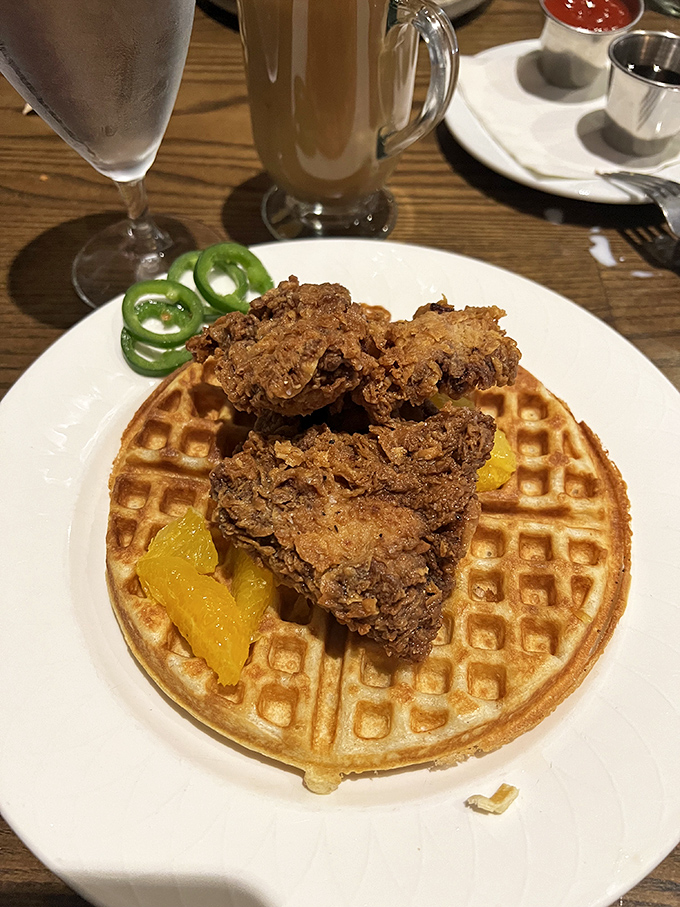 Chicken and Waffle: The unlikely courthouse duo &ndash; crispy fried chicken and golden waffle with orange segments making a case for sweet-savory perfection.