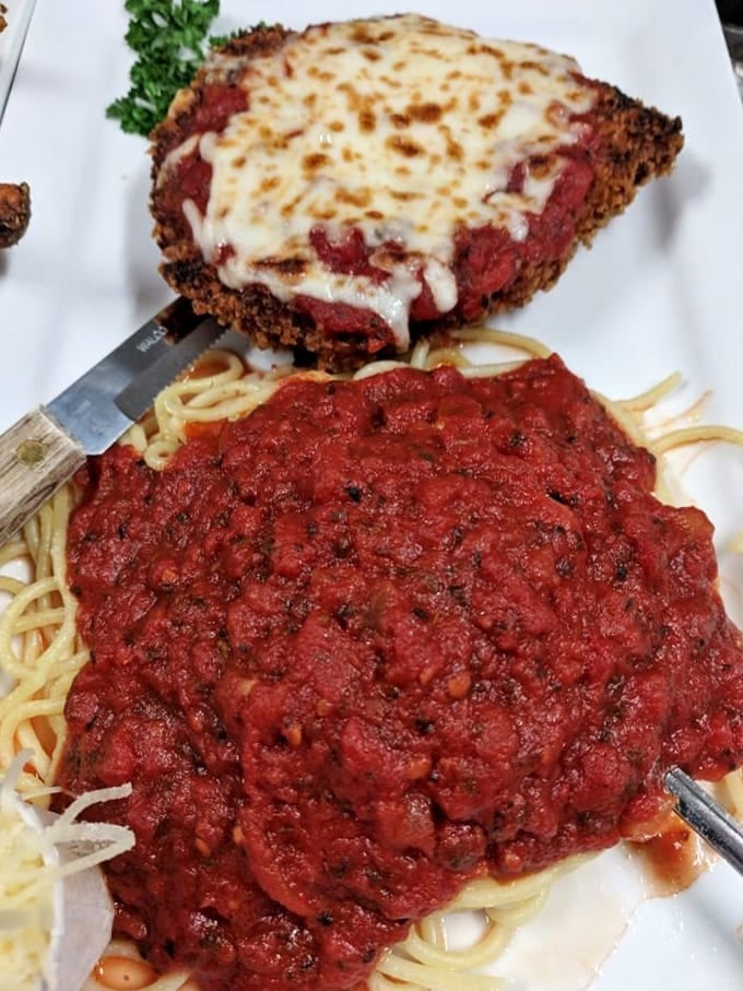 Chicken parmesan that would make an Italian grandmother nod in approval &ndash; crispy, saucy, cheesy perfection on a plate.
