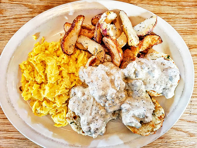 Morning salvation comes in the form of fluffy biscuits smothered in peppery gravy, with perfectly scrambled eggs and home fries.