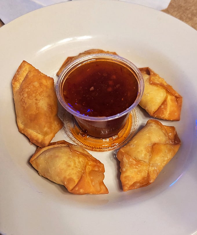 Golden crab rangoons surrounding their sweet chili dipping companion &ndash; the perfect opening act before the wing main event.