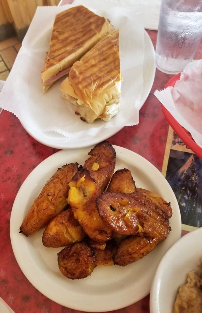 The contrast of crispy, pressed Cuban bread against those caramelized sweet plantains creates a textural symphony that deserves a standing ovation.