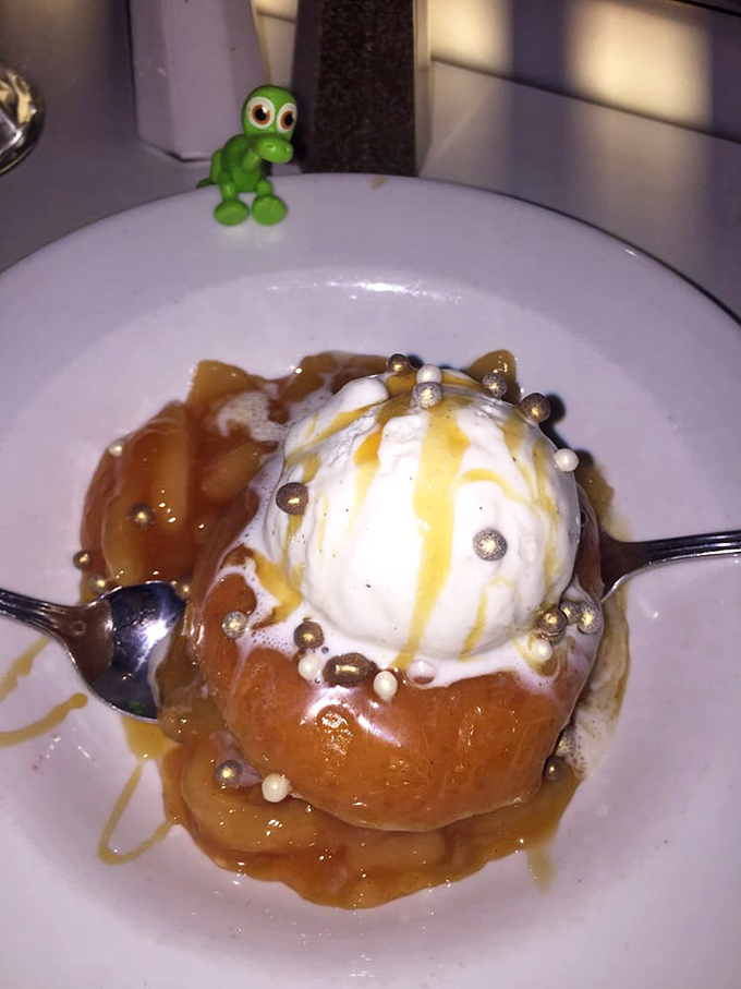 Dessert is a warm affair with ice cream melting into caramelized apples, because someone decided you needed one more reason to skip the gym tomorrow.