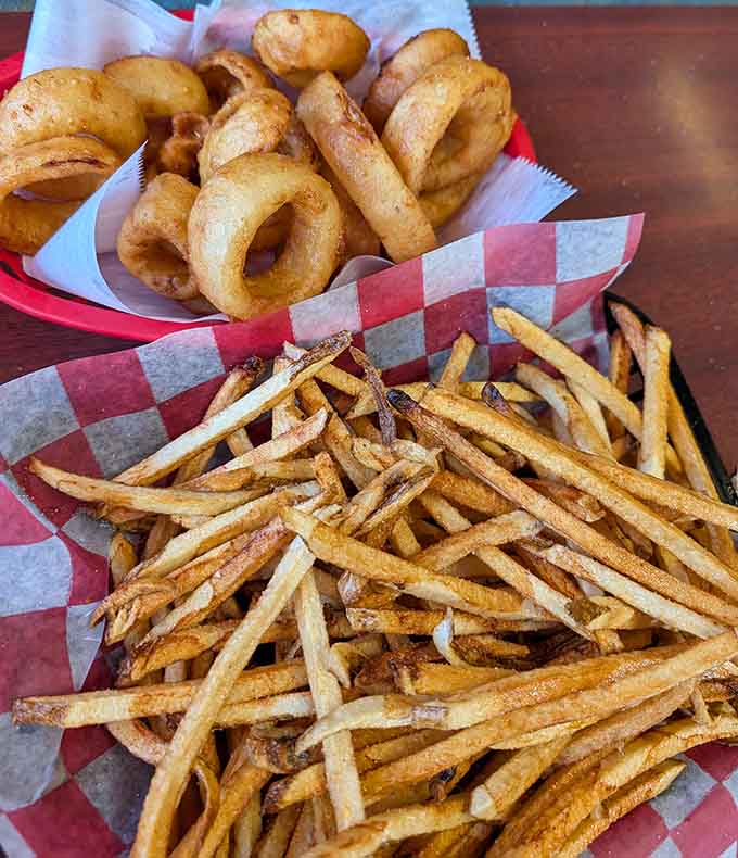 Golden fries and crispy onion rings provide the perfect savory foundation before you dive into dessert territory headfirst.
