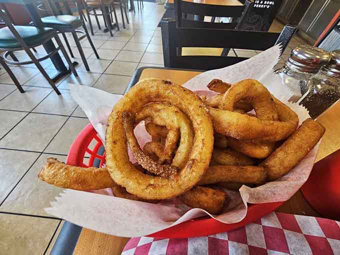 These aren't your average onion rings, they're thick-cut circles of fried perfection that crunch with serious authority and sweet satisfaction.