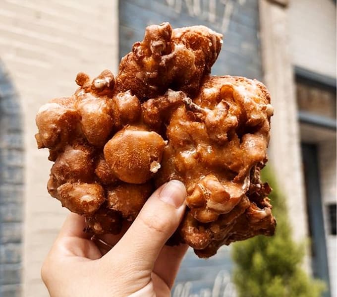Behold the apple fritter in all its irregular, glaze-covered glory, a pastry that requires both hands and zero regrets.