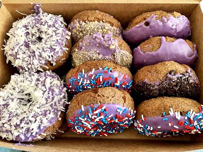 The box everyone hopes shows up at the office meeting &ndash; a purple portfolio of pastry perfection that makes choosing just one impossible.