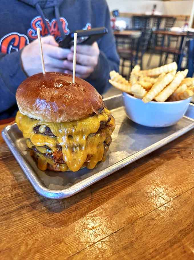 The "Elvis" burger defies gravity and good sense with double patties drowning in melted cheese &ndash; a beautiful disaster waiting to happen.
