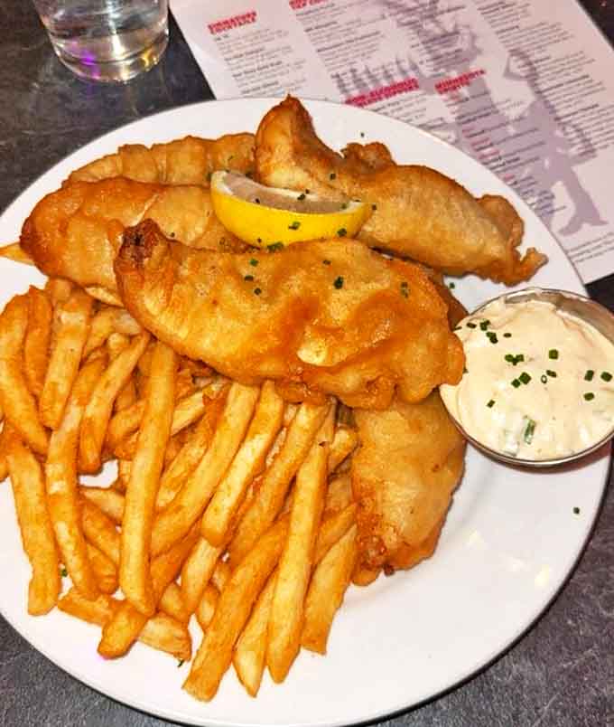 Fish and chips elevated beyond pub fare &ndash; flaky white fish in golden batter alongside perfectly crisp fries that demand to be savored, not rushed.