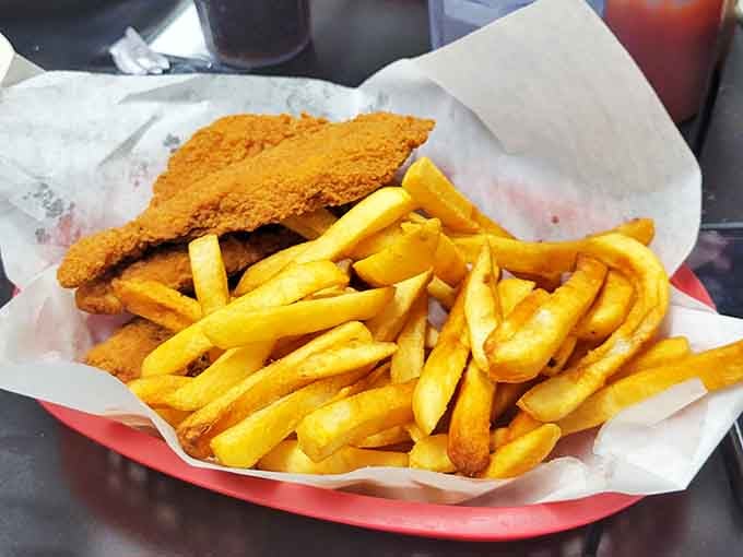 Fish and chips that hit all the right notes: crunchy exterior, flaky interior, and enough fries to make sharing completely optional.