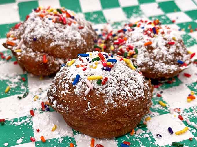 Funfetti fritters bring the party with colorful sprinkles and powdered sugar, like tiny celebrations you can eat with your hands.