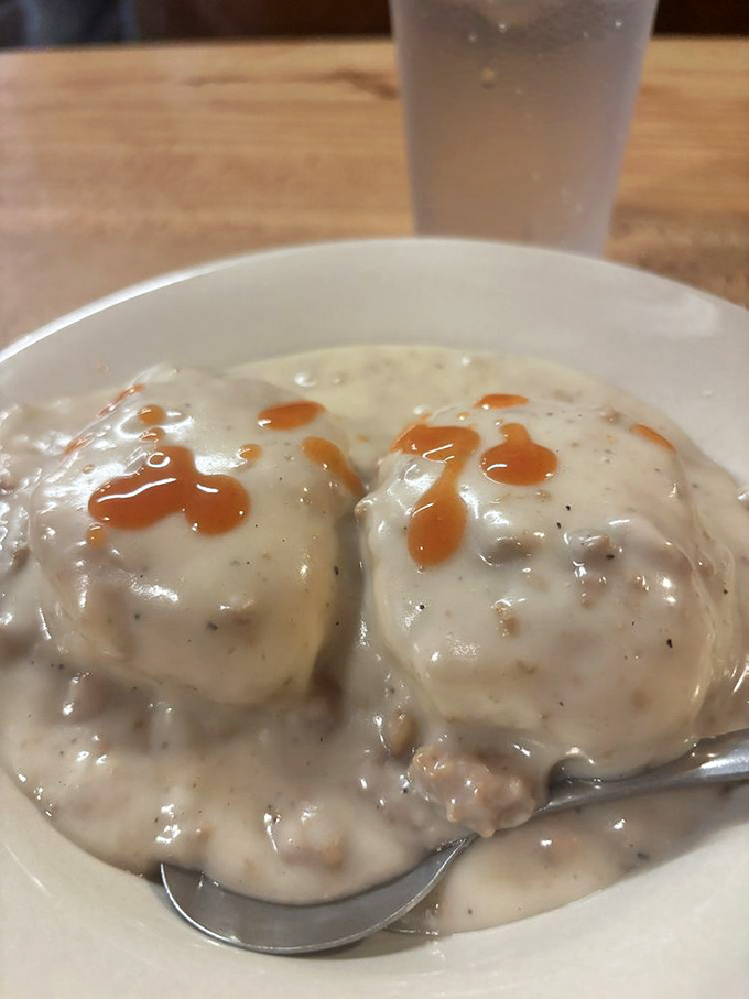 Biscuits drowning in sausage gravy, because sometimes you need comfort food that actually comforts, not just photographs well.