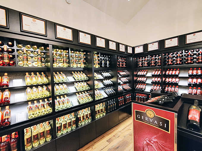 Award-winning bottles stand in formation like soldiers guarding liquid treasure—each label a promise of the craftsmanship and passion poured into every vintage.