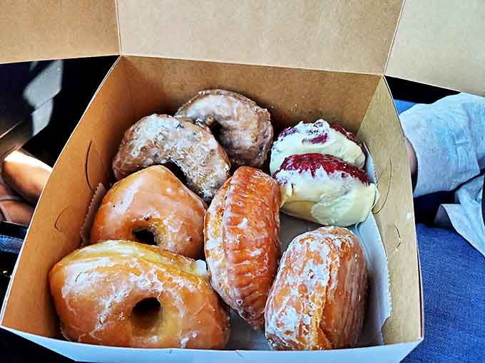 The holy grail of breakfast indulgences – perfectly executed glazed donuts with that signature golden exterior and pillowy interior.