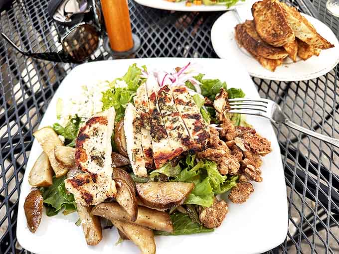 A salad that doesn't feel like punishment: grilled chicken, fresh greens, and enough flavor to make vegetables exciting.