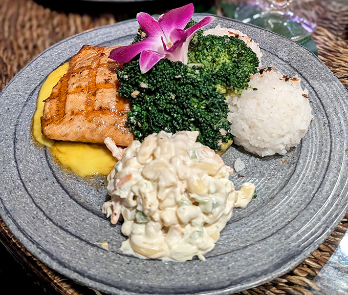 Grilled salmon gets the island treatment &ndash; perfectly cooked fish meets bright mango sauce, with broccoli standing at attention like tiny palm trees.