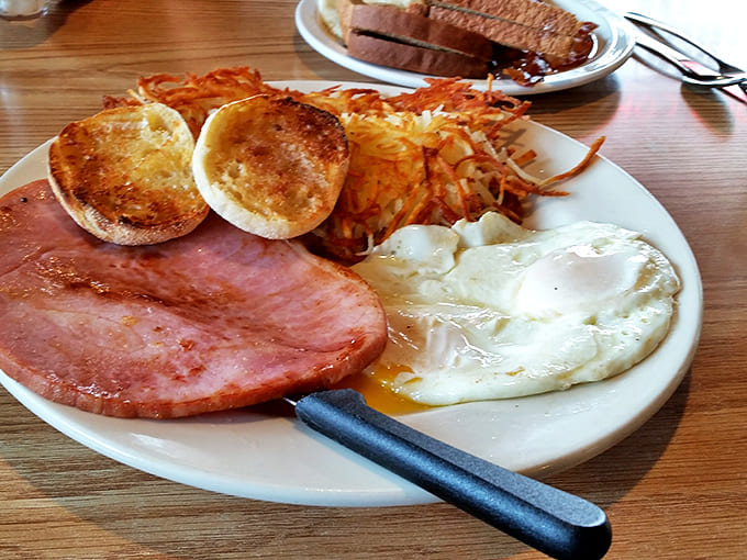 This plate screams "Good Morning!" &ndash; golden hash browns, thick-cut ham, and English muffins toasted to perfection.