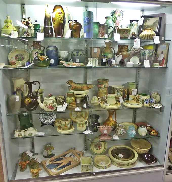 Shelves of pottery waiting for someone to appreciate the craftsmanship that went into every curve and glaze.