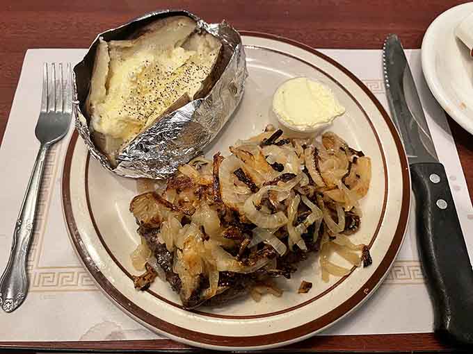 Chopped steak with grilled onions and a loaded baked potato, the holy trinity of Midwest comfort dining.