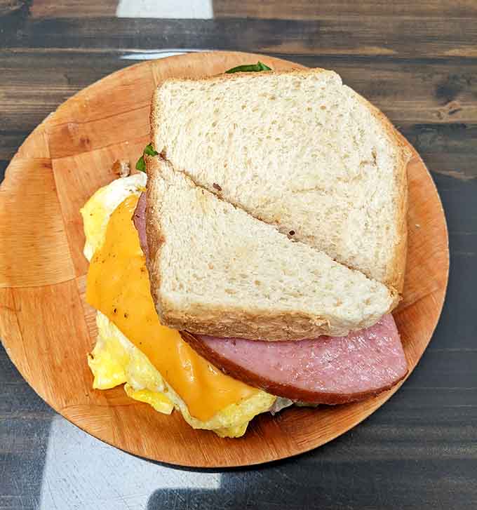 A hearty breakfast sandwich stacked with eggs, meat, and cheese provides the fuel you need to conquer your day.