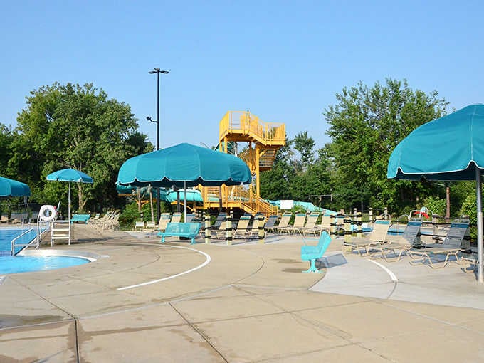 Teal umbrellas stand guard against the summer sun, offering peaceful havens between aquatic adventures.