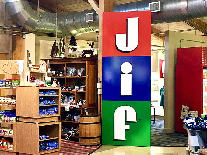 The iconic JIF sign stands tall in primary colors, a beacon guiding peanut butter pilgrims to their creamy, crunchy promised land.