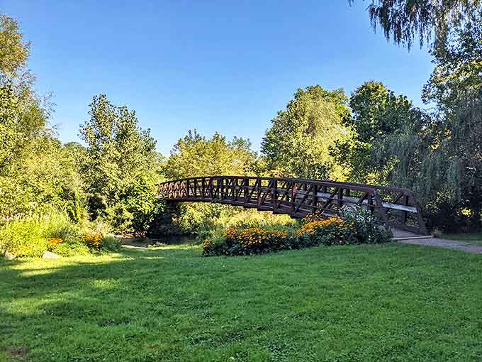 Ketchum Park's wooden bridge invites visitors to cross into tranquility, where wildflowers and birdsong create nature's perfect soundtrack for afternoon strolls.