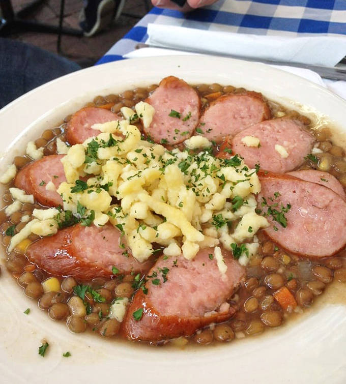 Hearty lentil soup dotted with savory sausage slices &ndash; the kind of comfort food that makes Minnesota winters slightly more bearable.