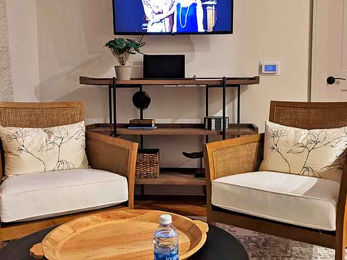 Mid-century modern furniture and warm wood tones create a living space that feels both stylish and welcoming for guests to gather.