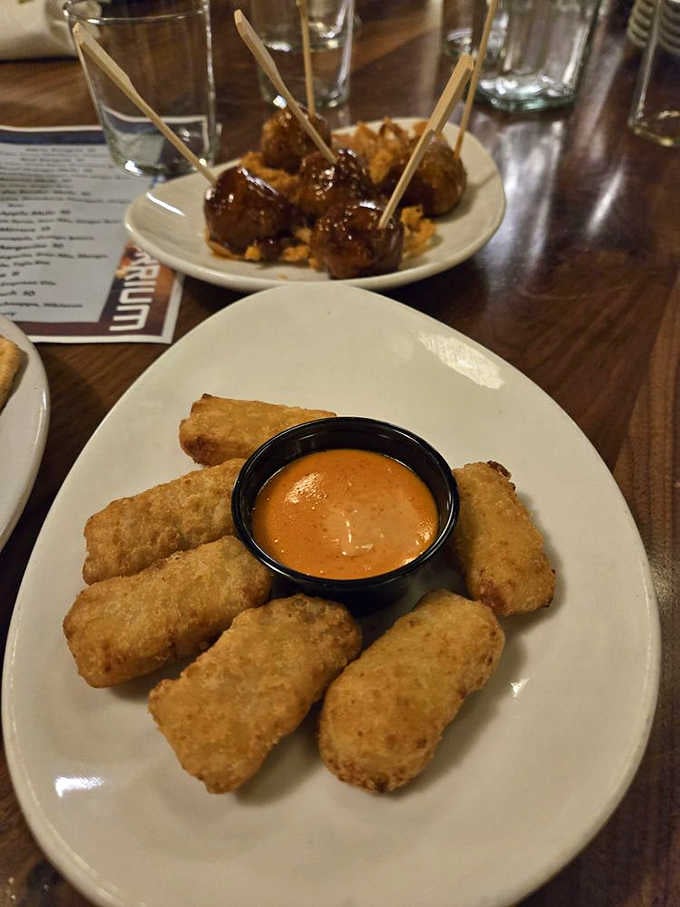 Golden-fried mac bites and saucy meatballs on skewers &ndash; because the best arcade food is both delicious and strategically designed for one-handed eating.