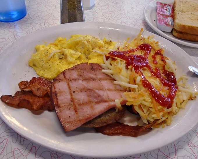 When breakfast means business: eggs, ham, bacon, and hash browns team up to create the morning power meal of champions.