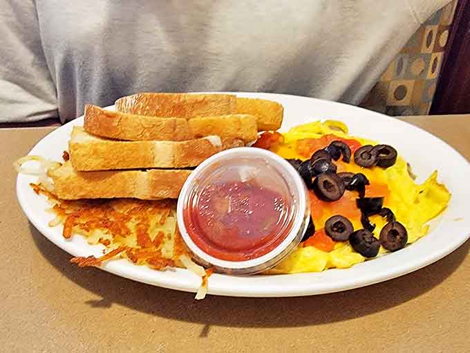 A Mexican-inspired breakfast fiesta featuring eggs, toast, and hash browns—proof that Maggie's comfort food speaks multiple culinary languages.
