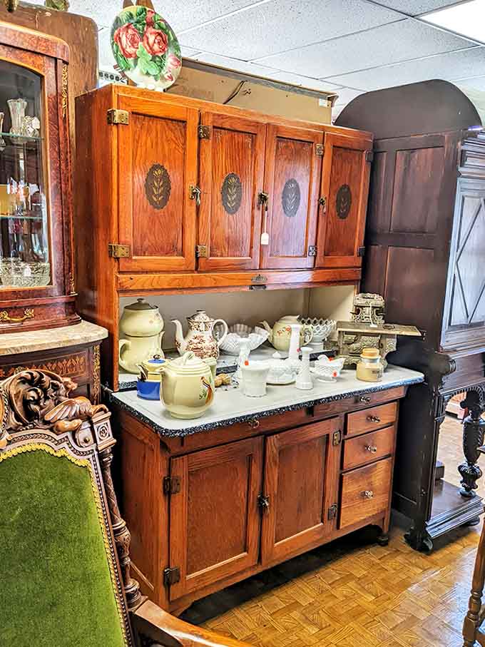 Grandma's kitchen never looked this good – a perfectly preserved Hoosier cabinet displays vintage kitchenware that puts modern equivalents to shame.