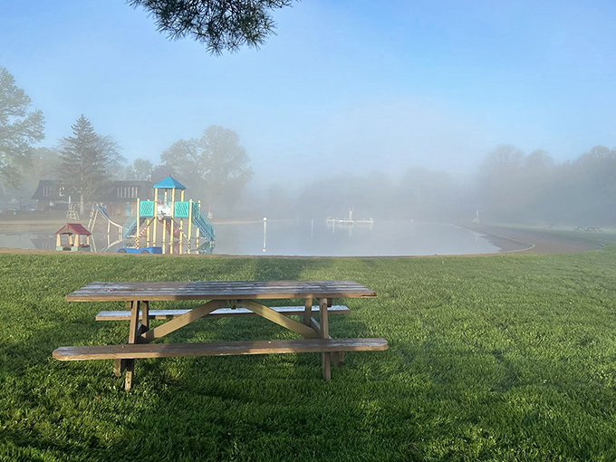 Fog dancers across the water create a mystical morning tableau, transforming an ordinary swimming hole into something straight out of a fairy tale.