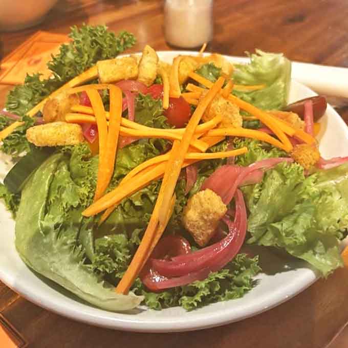 Proof that healthy eating doesn't mean flavor sacrifice &ndash; crisp greens, vibrant veggies, and a dressing that ties it all together beautifully.