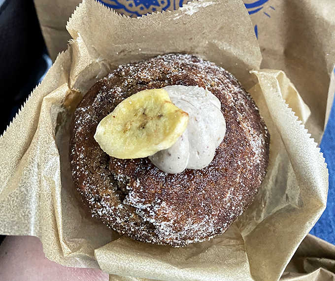 Muffin: A banana-topped creation dusted with powdered sugar that transforms the humble muffin into something worthy of worship.